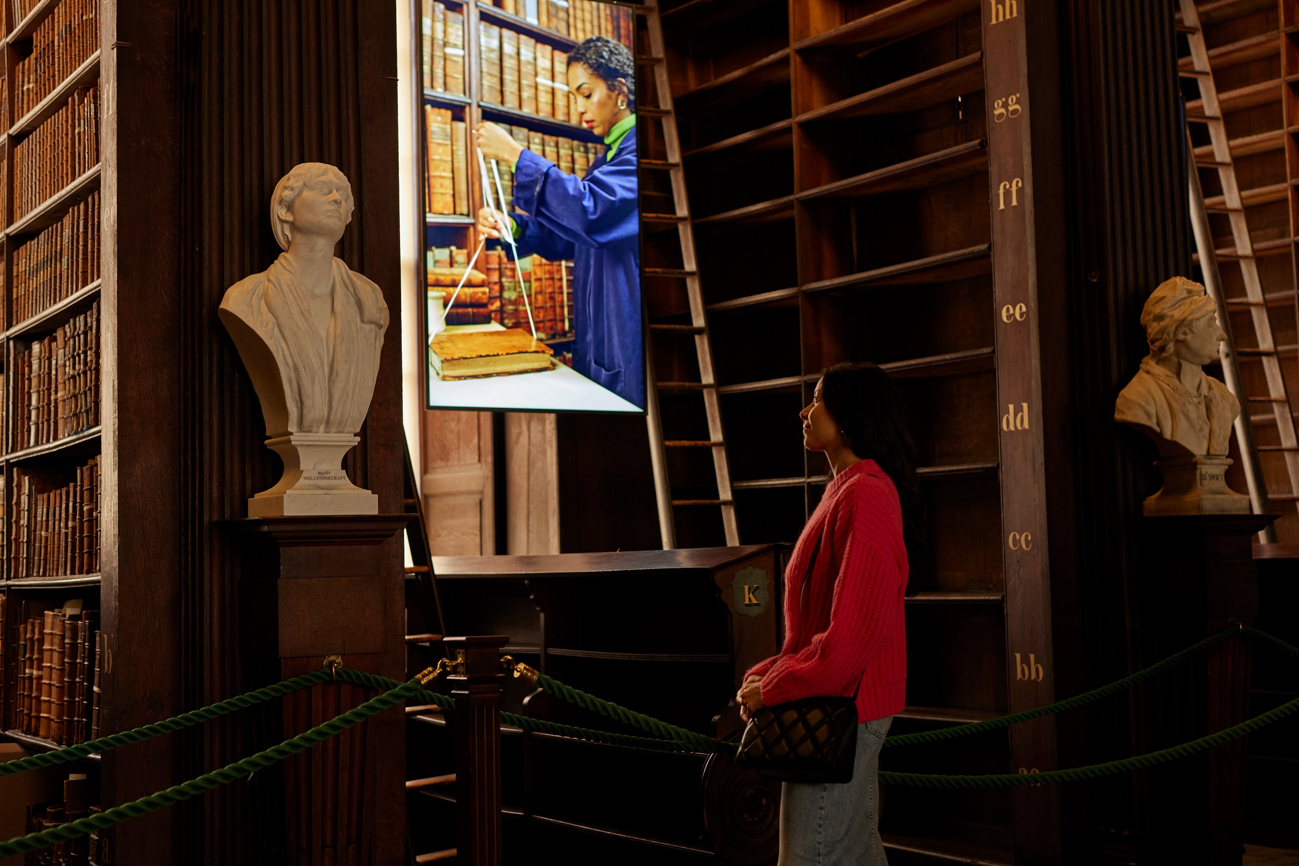 Why have books been removed from Trinity College Library?